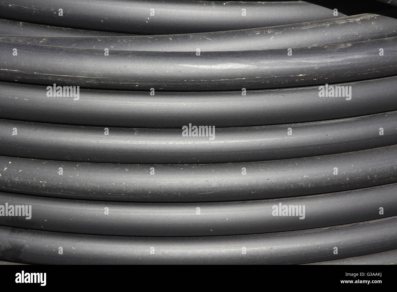 Background with bright black tubes Stock Photo - Alamy