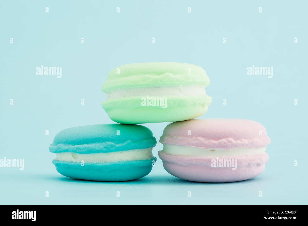 French colorful macarons stacks on pastel background, copy space Stock ...