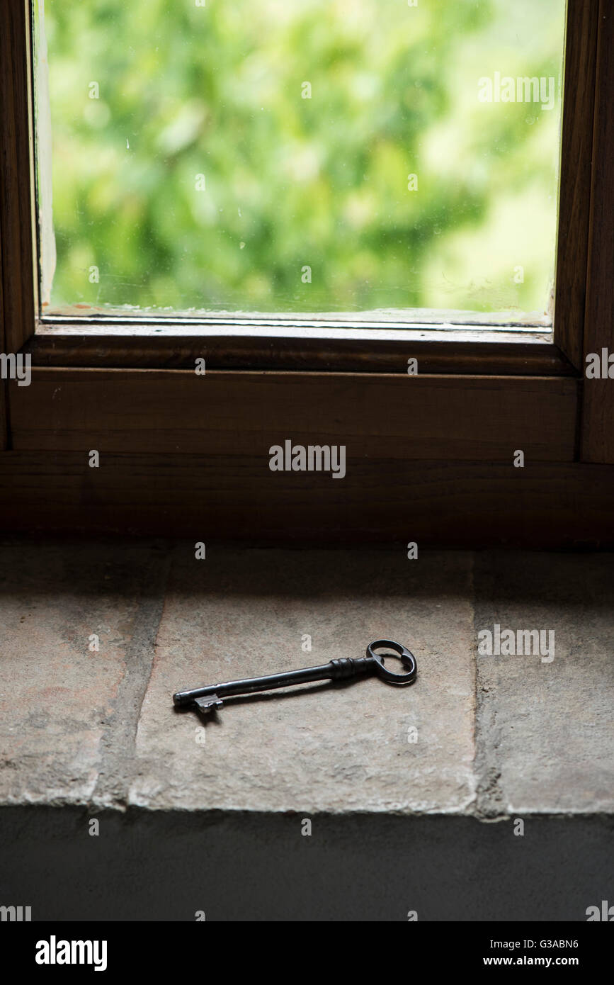 Old iron key on stone Stock Photo - Alamy