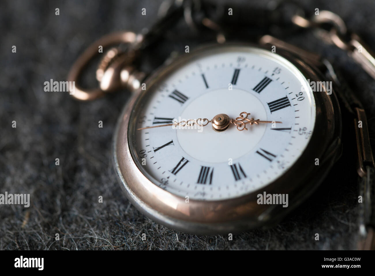 A small golden pocket watch Stock Photo - Alamy