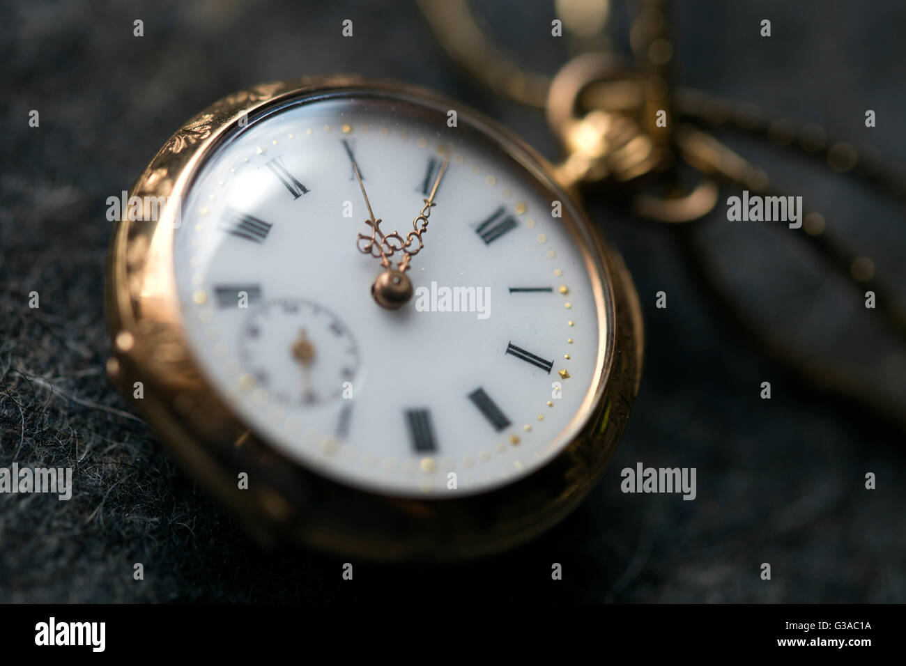 A small golden pocket watch Stock Photo - Alamy