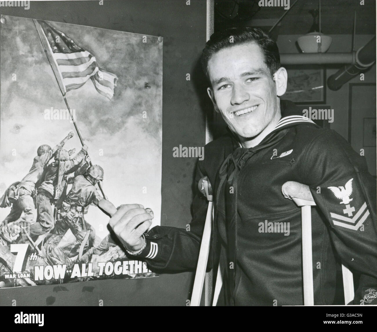 Navy Pharmacist's Mate Second Class John H. Bradley points to the 7th ...