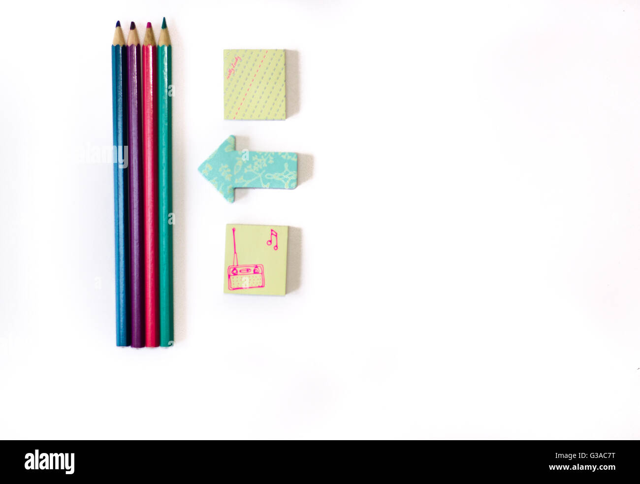 pencils, post it notes and notebook, on desk Stock Photo - Alamy