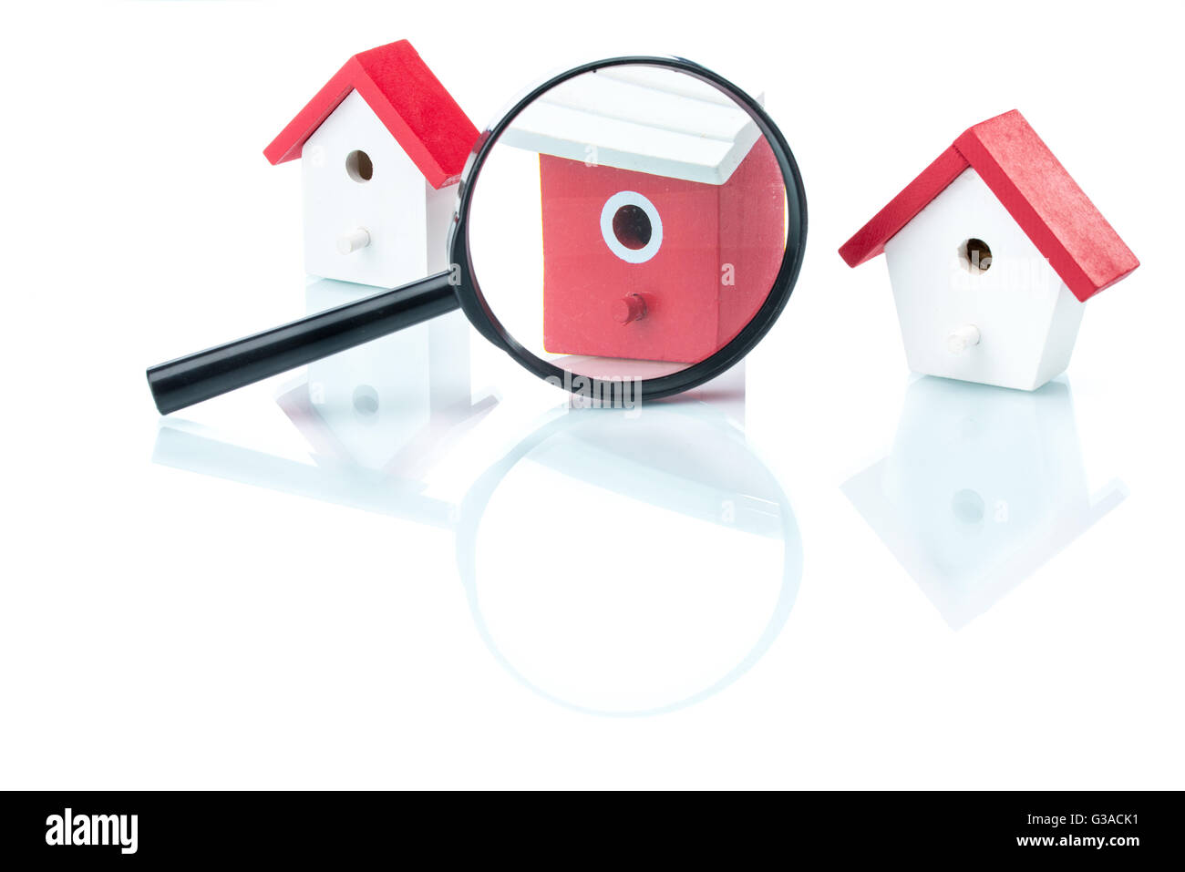 house search concept, house model with magnifying on white background ...