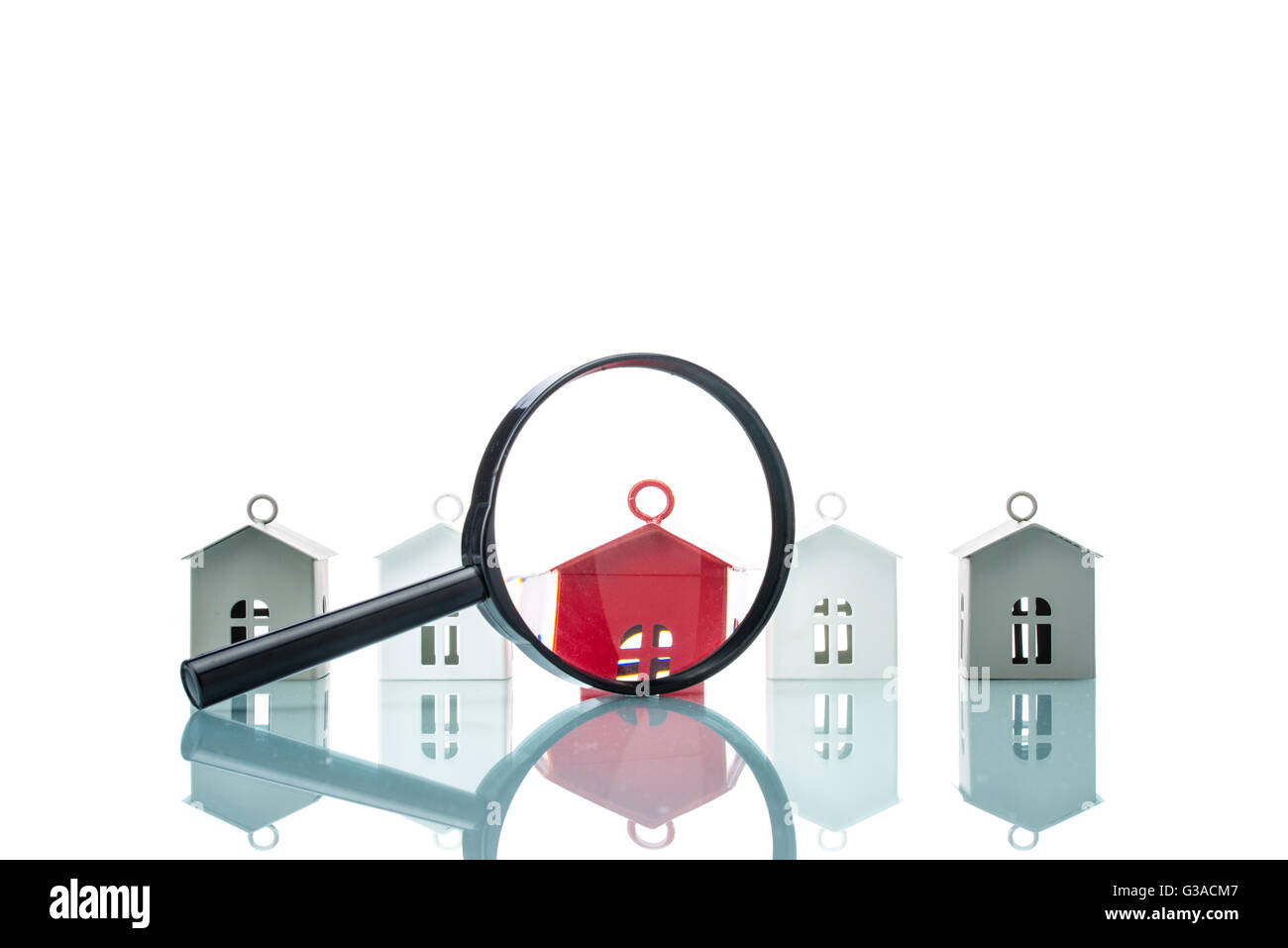 house search concept, house model with magnifying on white background ...