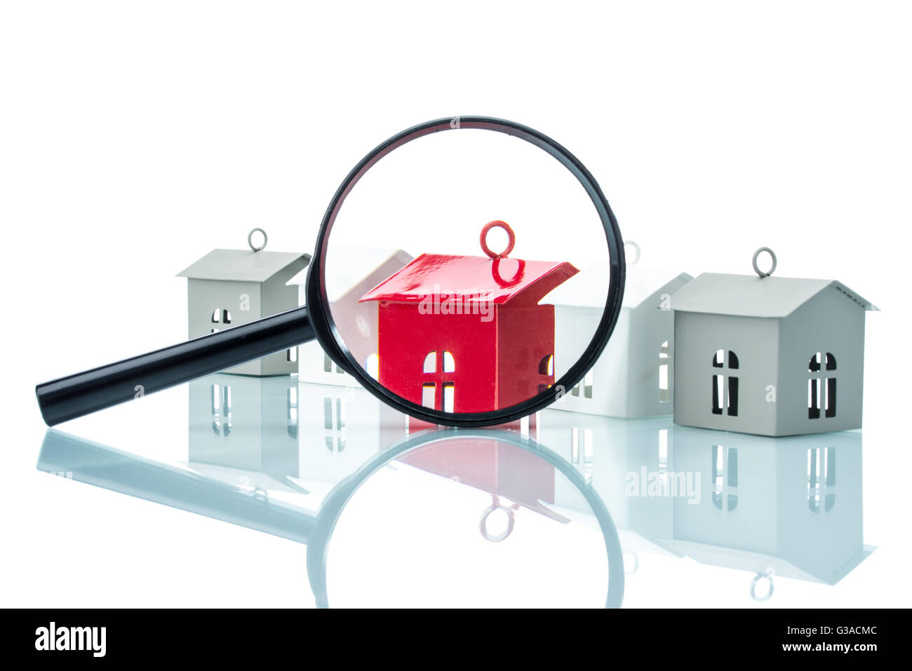 house search concept, house model with magnifying on white background ...
