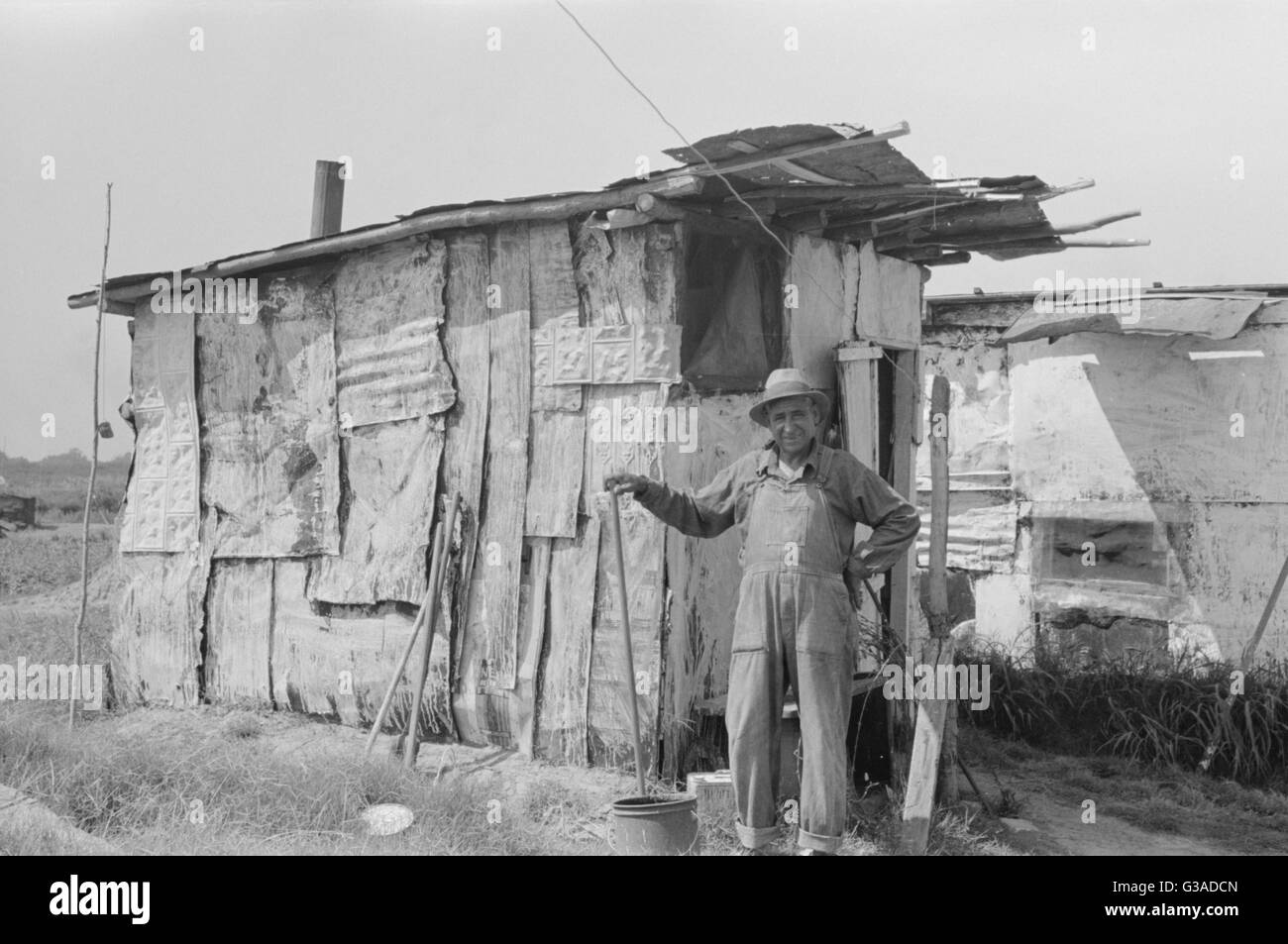Resident of Tin Town on river side of levee, Caruthersville Stock Photo ...