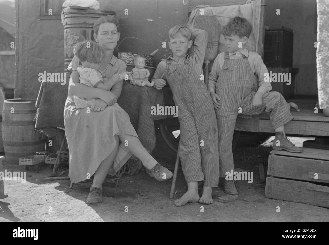 White migrant mother with children in front of trailer home Stock Photo ...