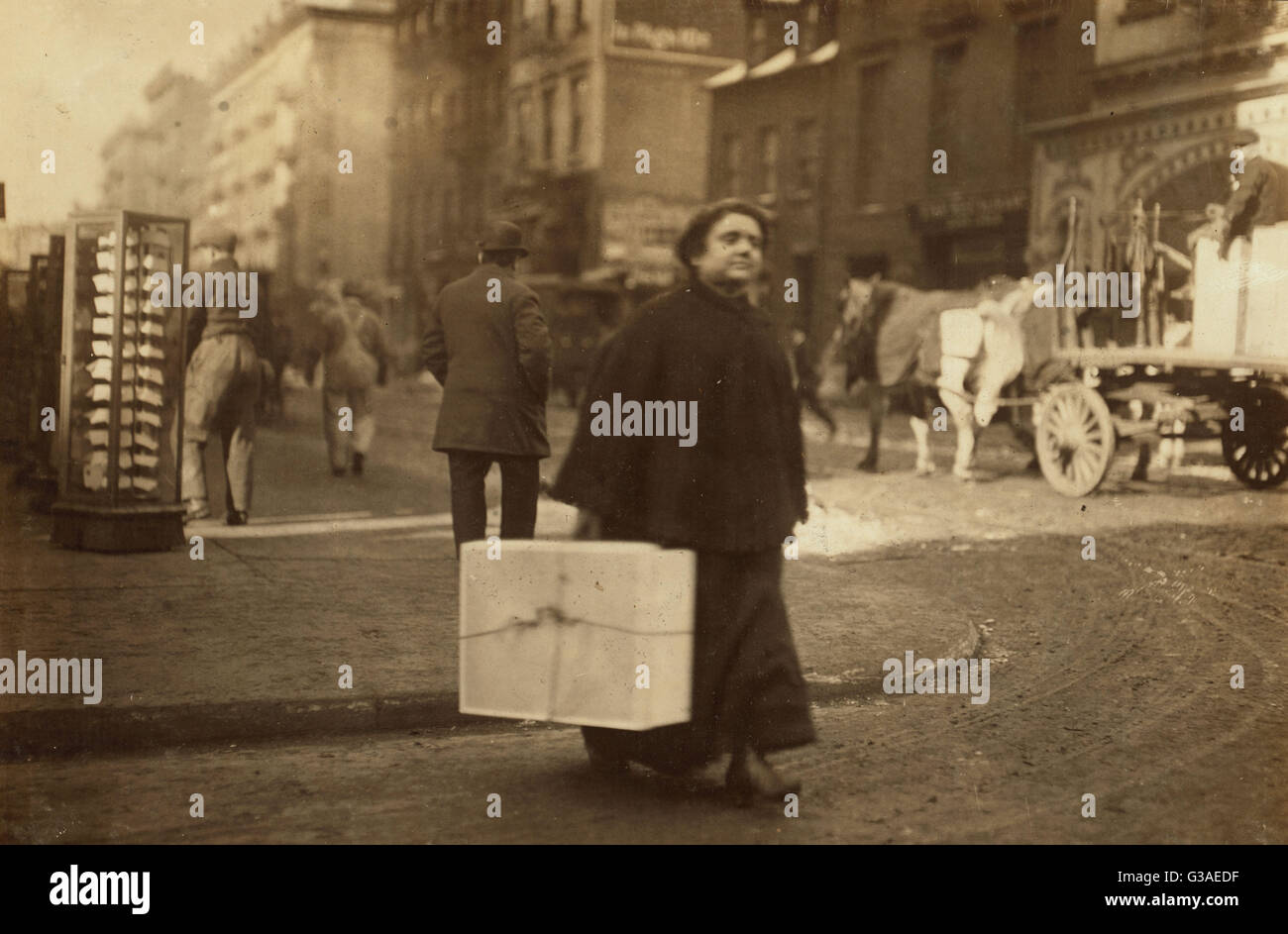 Woman carrying flowers home to work upon Stock Photo - Alamy