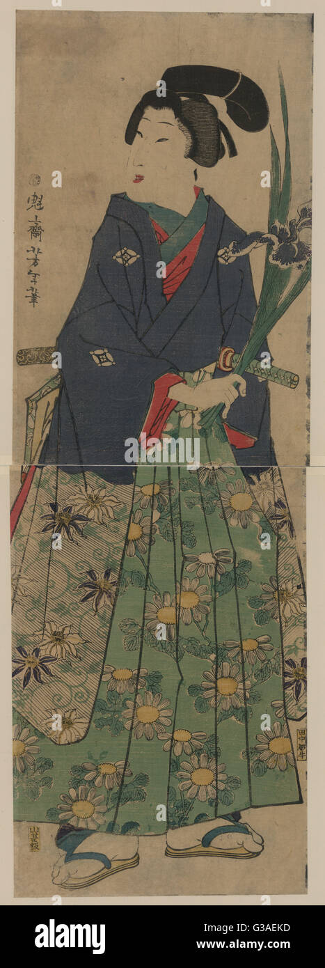 Young dandy carrying irises Stock Photo - Alamy