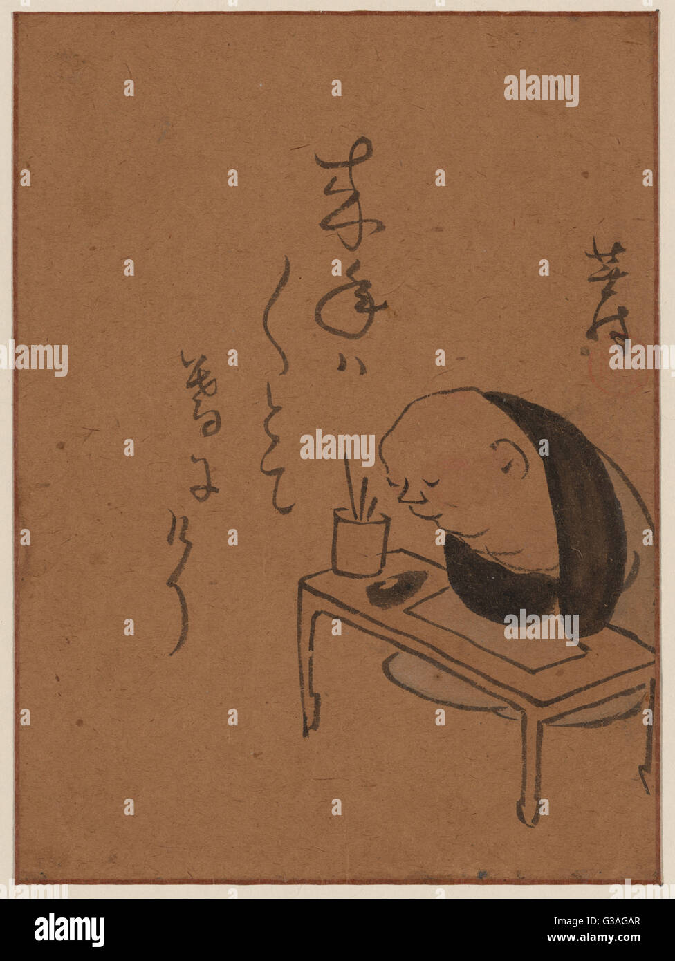 A man or monk seated at a table, leaning on his arms, possib Stock ...