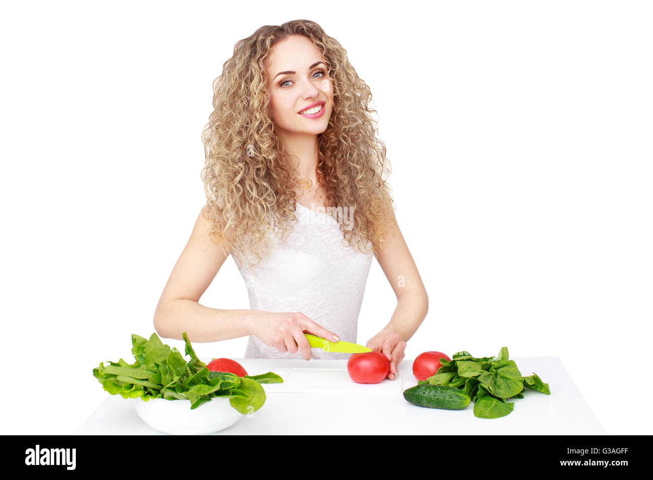 Woman girl preparing salad in Cut Out Stock Images & Pictures - Alamy