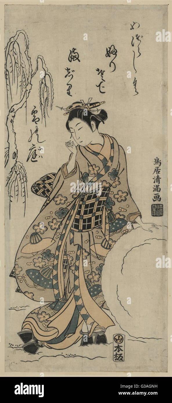 Young lady making a snowball Stock Photo - Alamy