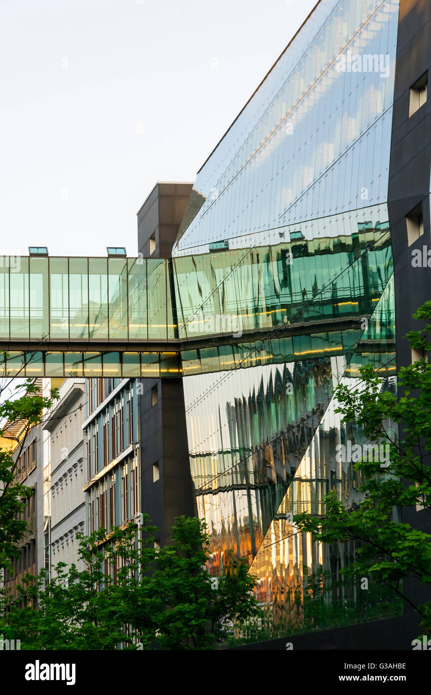 Modern office building with bridge reflecting light Stock Photo - Alamy