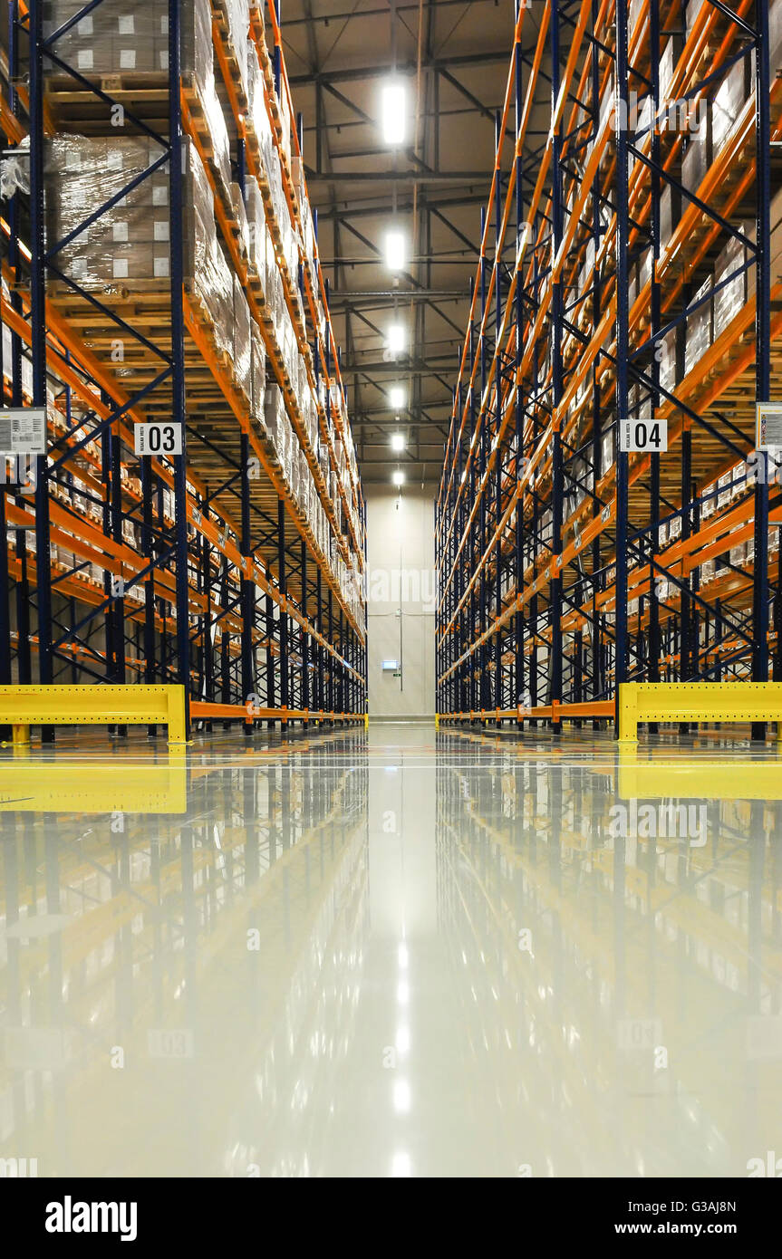 View through the racks of a large warehouse Stock Photo - Alamy