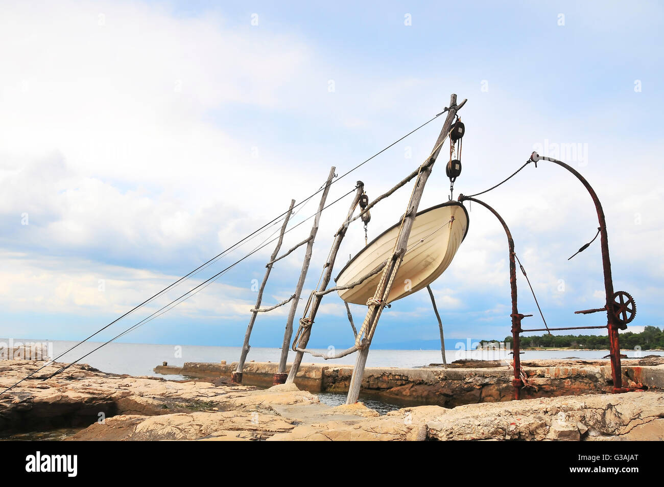 Traditional hoisting of boats ashore in northern Adriatic sea, a small ...