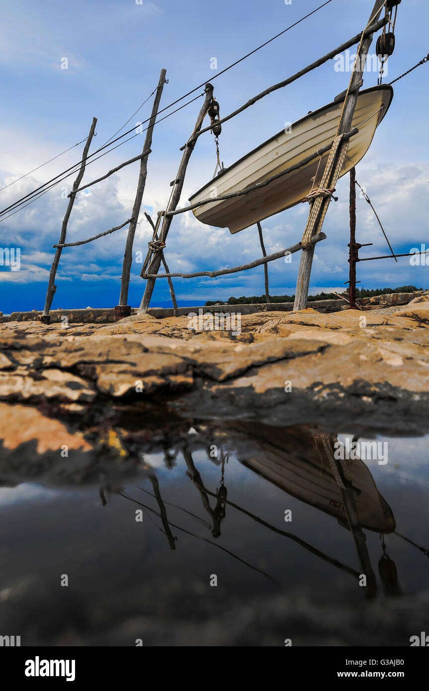Traditional hoisting of boats ashore in northern Adriatic sea, a small ...