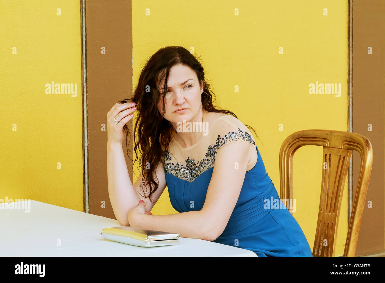 very beautiful woman is bored alone Stock Photo - Alamy