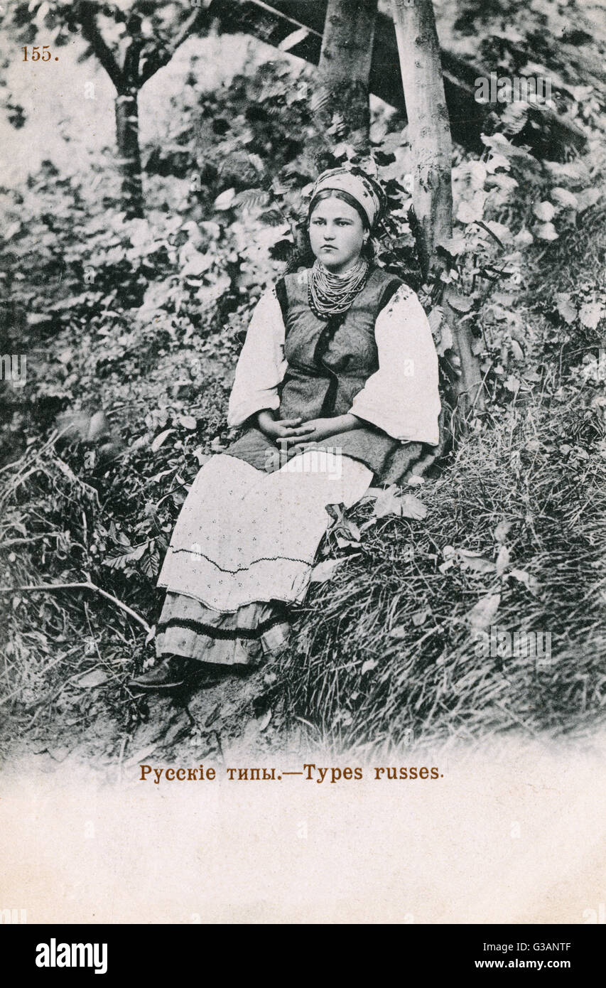 Sullen Russian girl seated in the undergrowth Stock Photo - Alamy