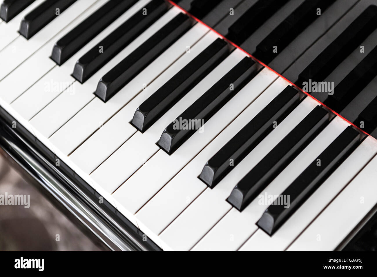 Close up on piano keys and reflection of them Stock Photo - Alamy