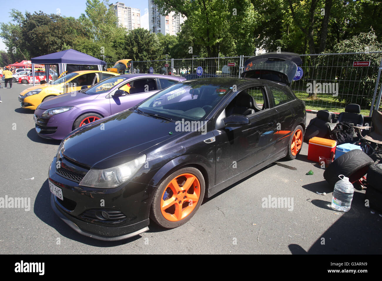 Parked cars that are waiting for the start of a race at Fast and ...