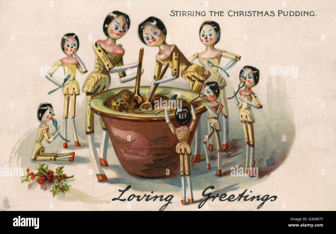 Wooden Dolls stirring the Christmas Pudding Stock Photo - Alamy