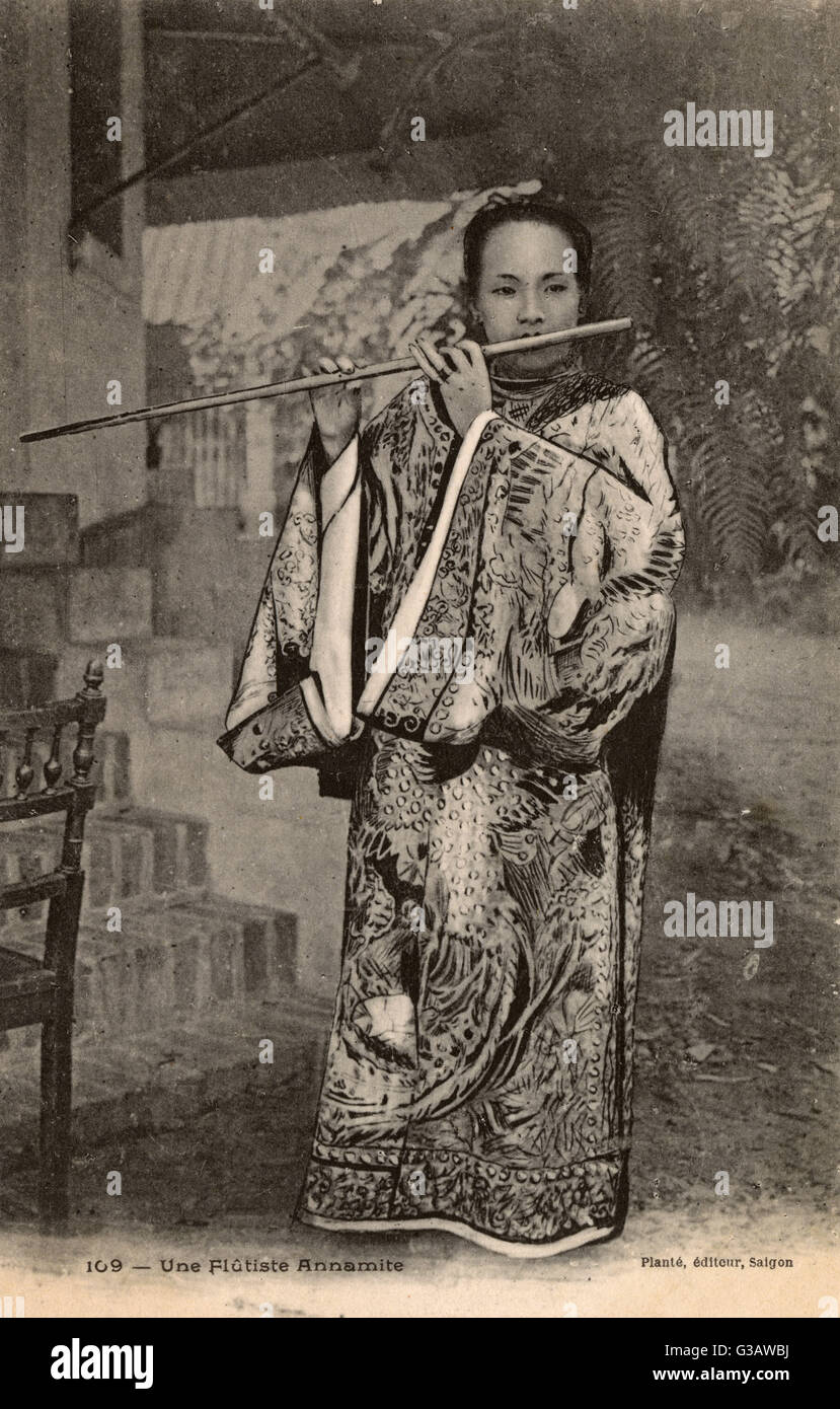 A beautiful female Annamite flautist - Vietnam Stock Photo - Alamy