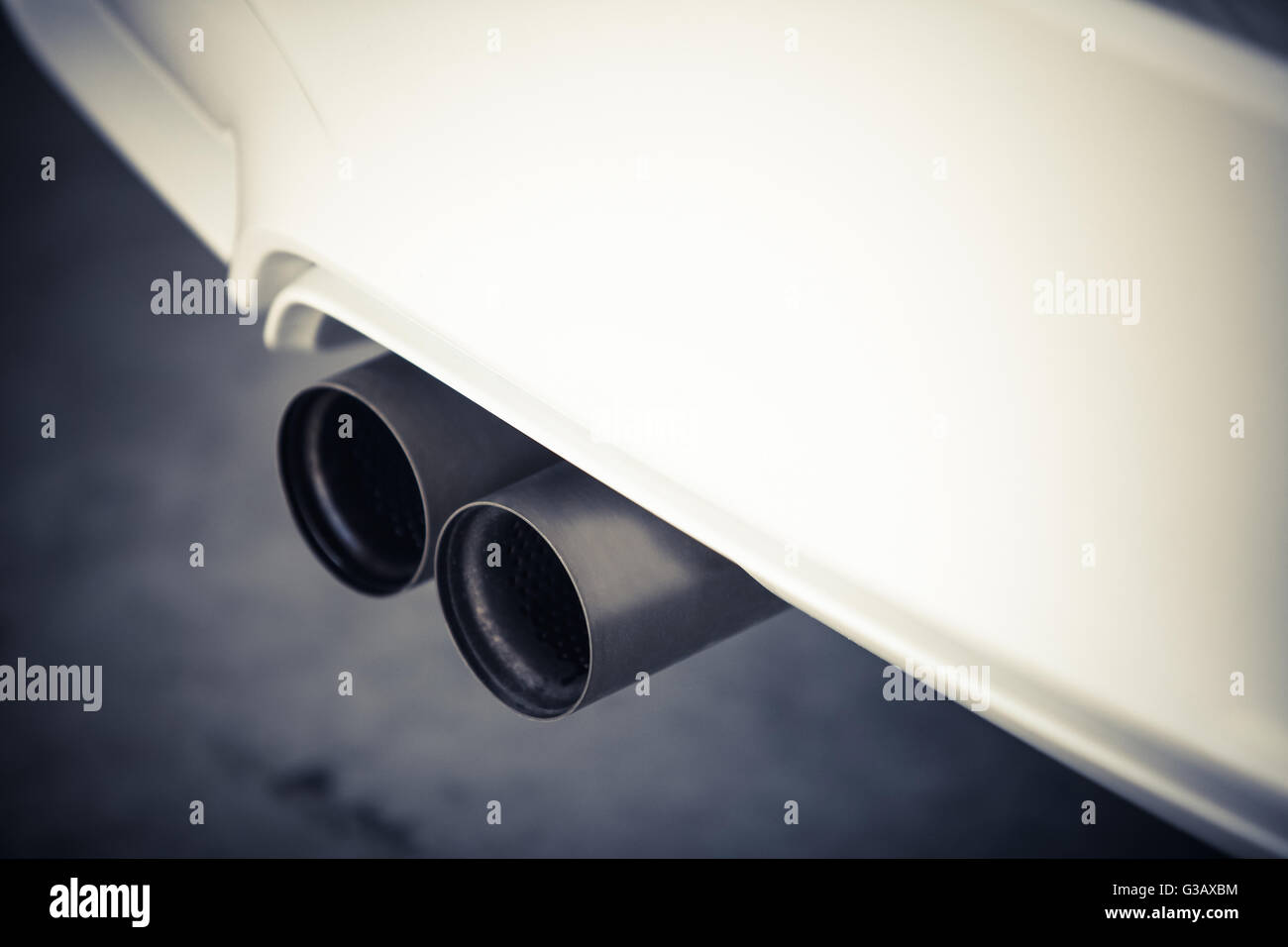 Detail of the double exhaust of a car Stock Photo - Alamy