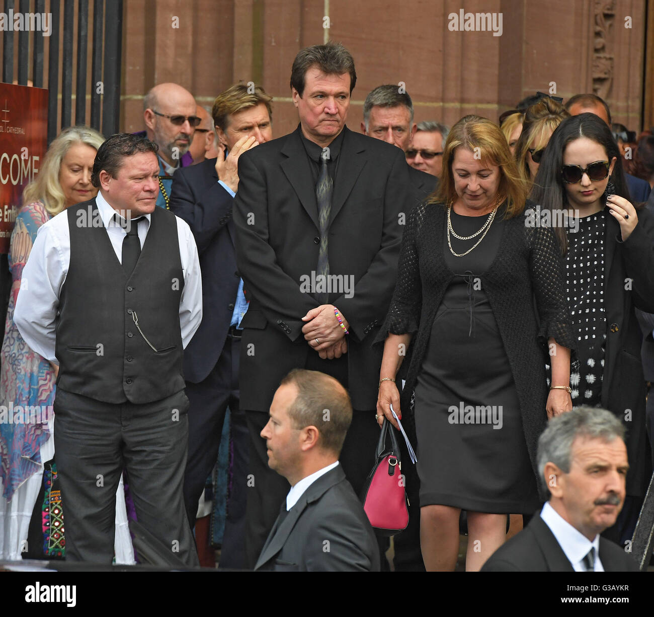 Peter Howitt (centre) leaves Liverpool Cathedral following the funeral ...