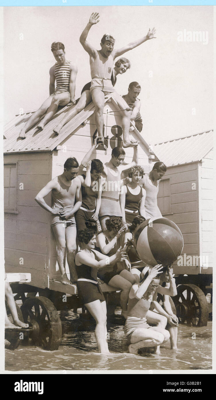 High jinks with a beach ball at Ostend as a group of young people form ...
