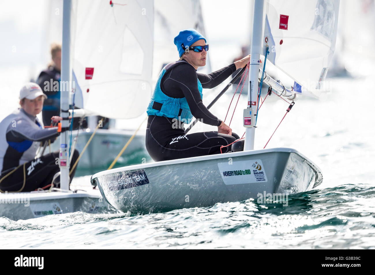 Team GBR Olympic sailor Alison Young (blue hat) pictured racing her ...