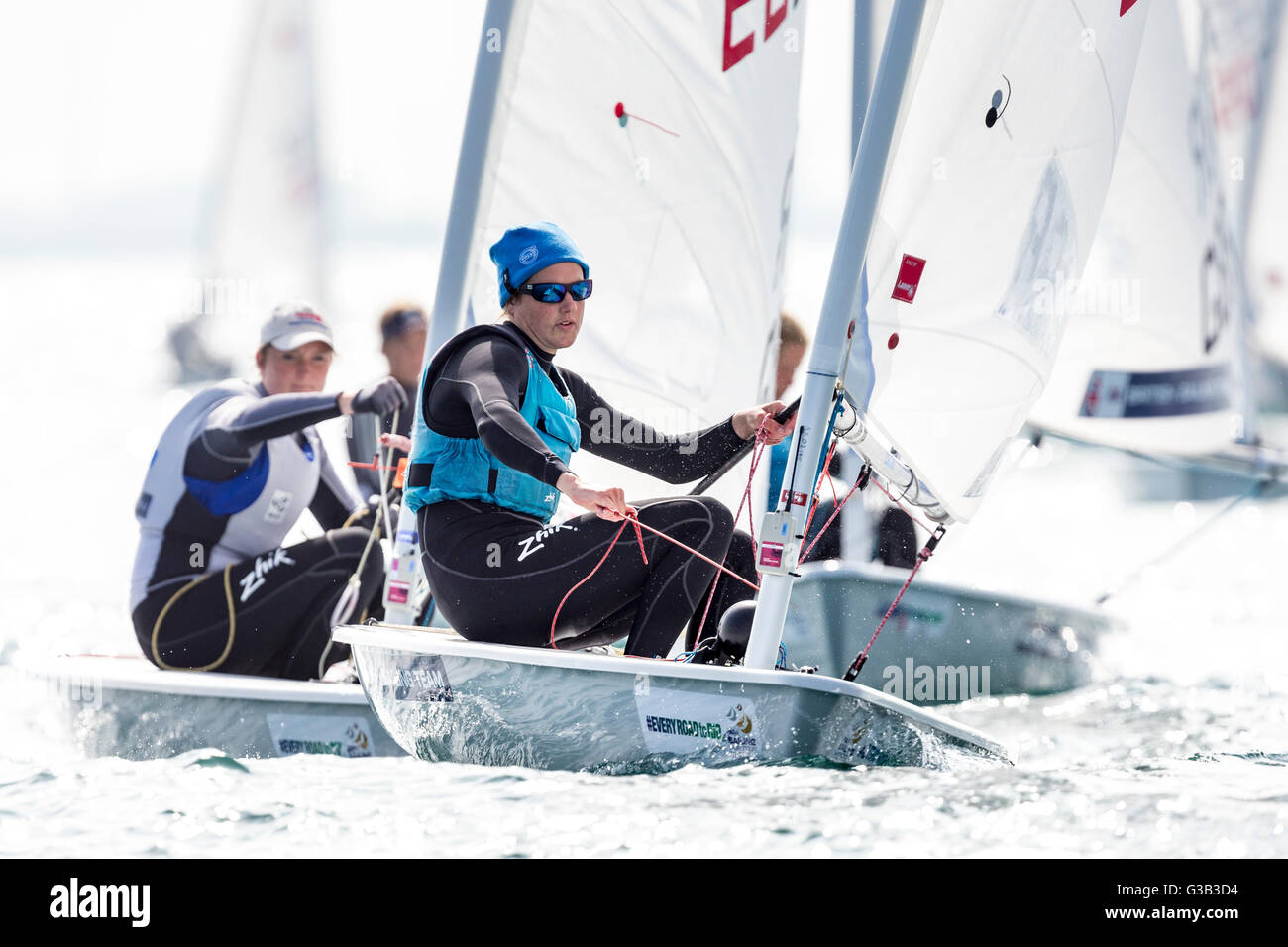 Team GBR Olympic sailor Alison Young (blue hat) pictured racing her ...