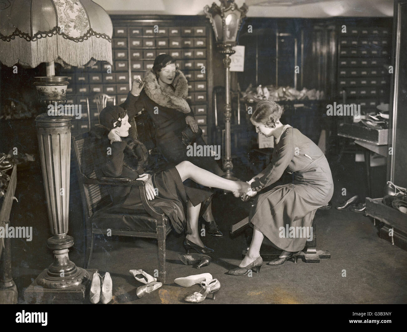 TRYING ON SHOES Stock Photo - Alamy