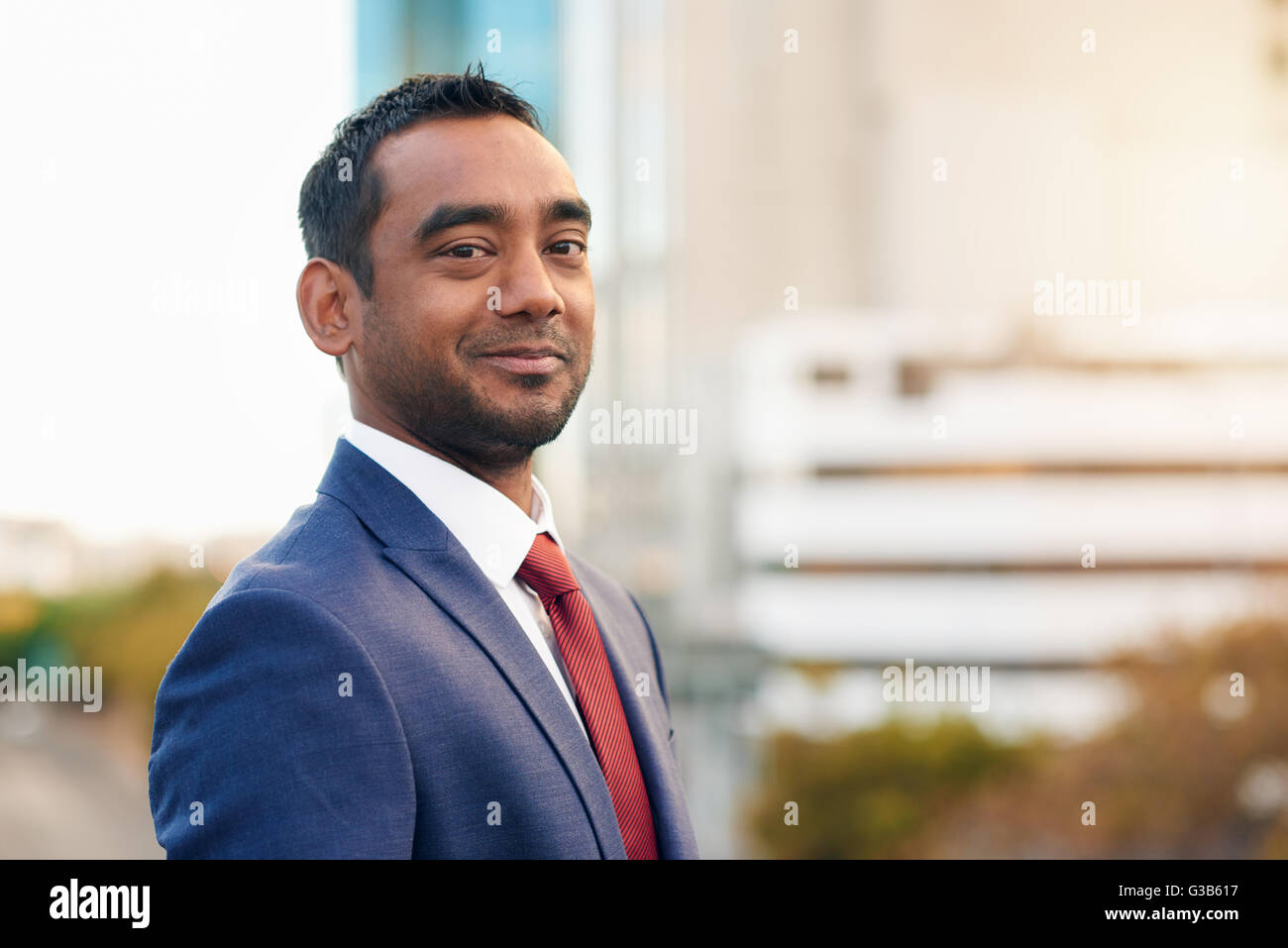Portrait of a smiling businessman with the city in the background Stock ...