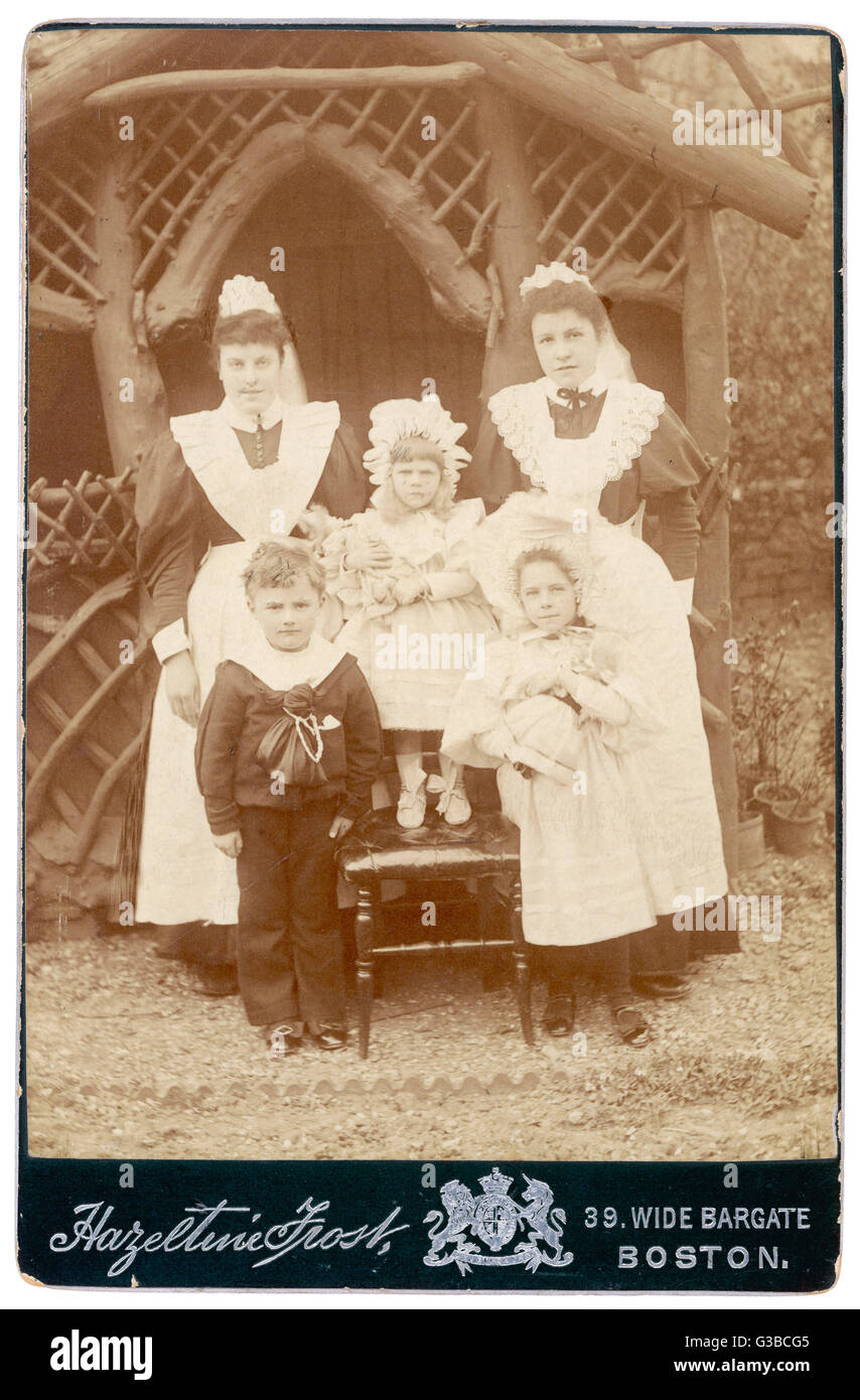 2 NANNIES & 3 CHILDREN Stock Photo - Alamy