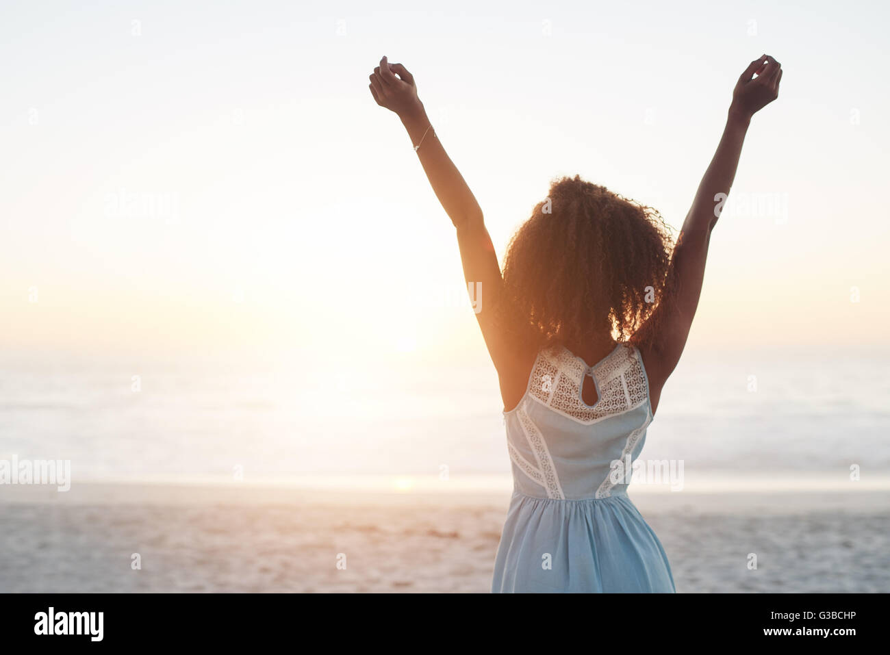 Basking in a beach sunset Stock Photo - Alamy