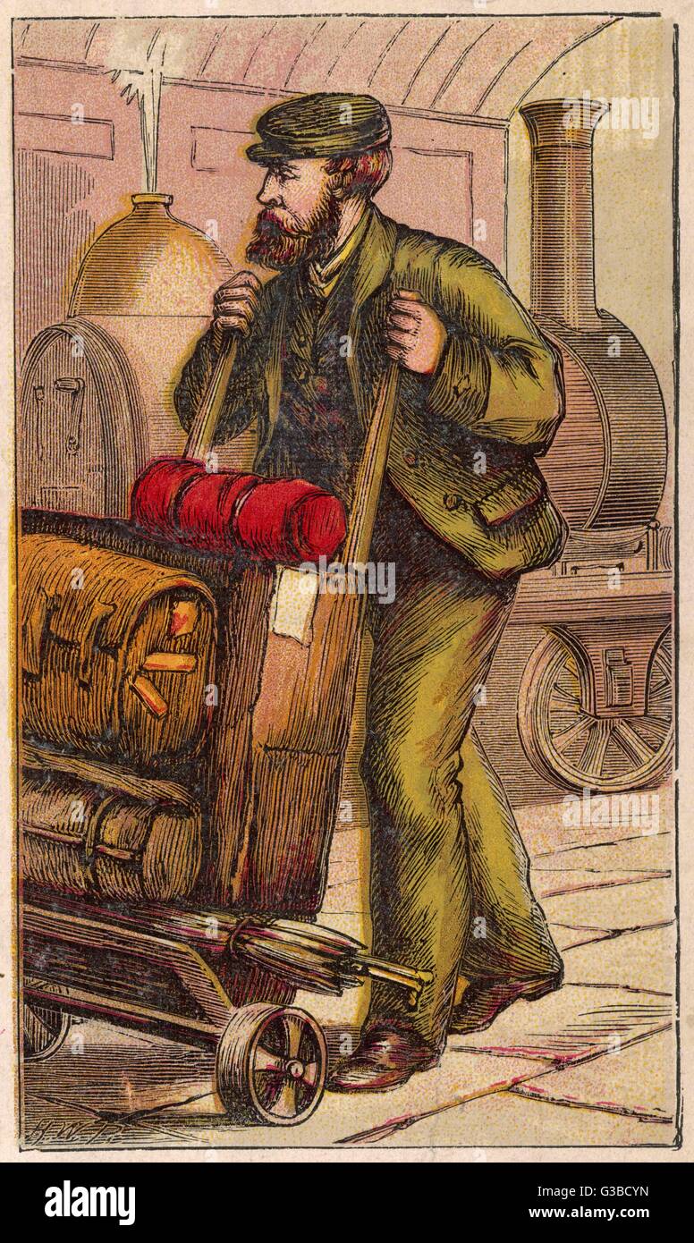 A station porter carries a passenger's baggage on his trolley. Date ...
