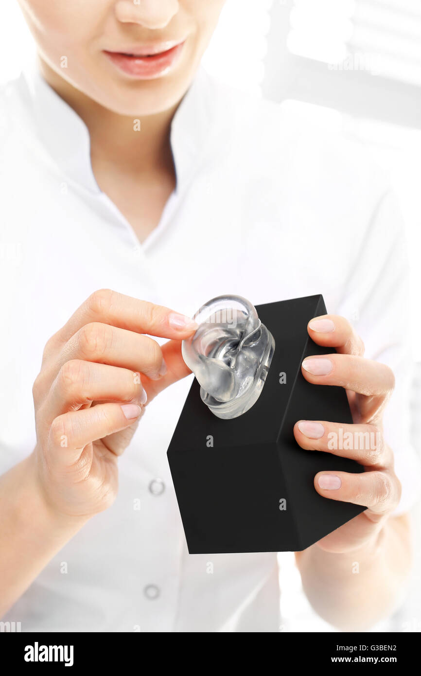 Female surgeon with silicone cast of the ear Stock Photo - Alamy
