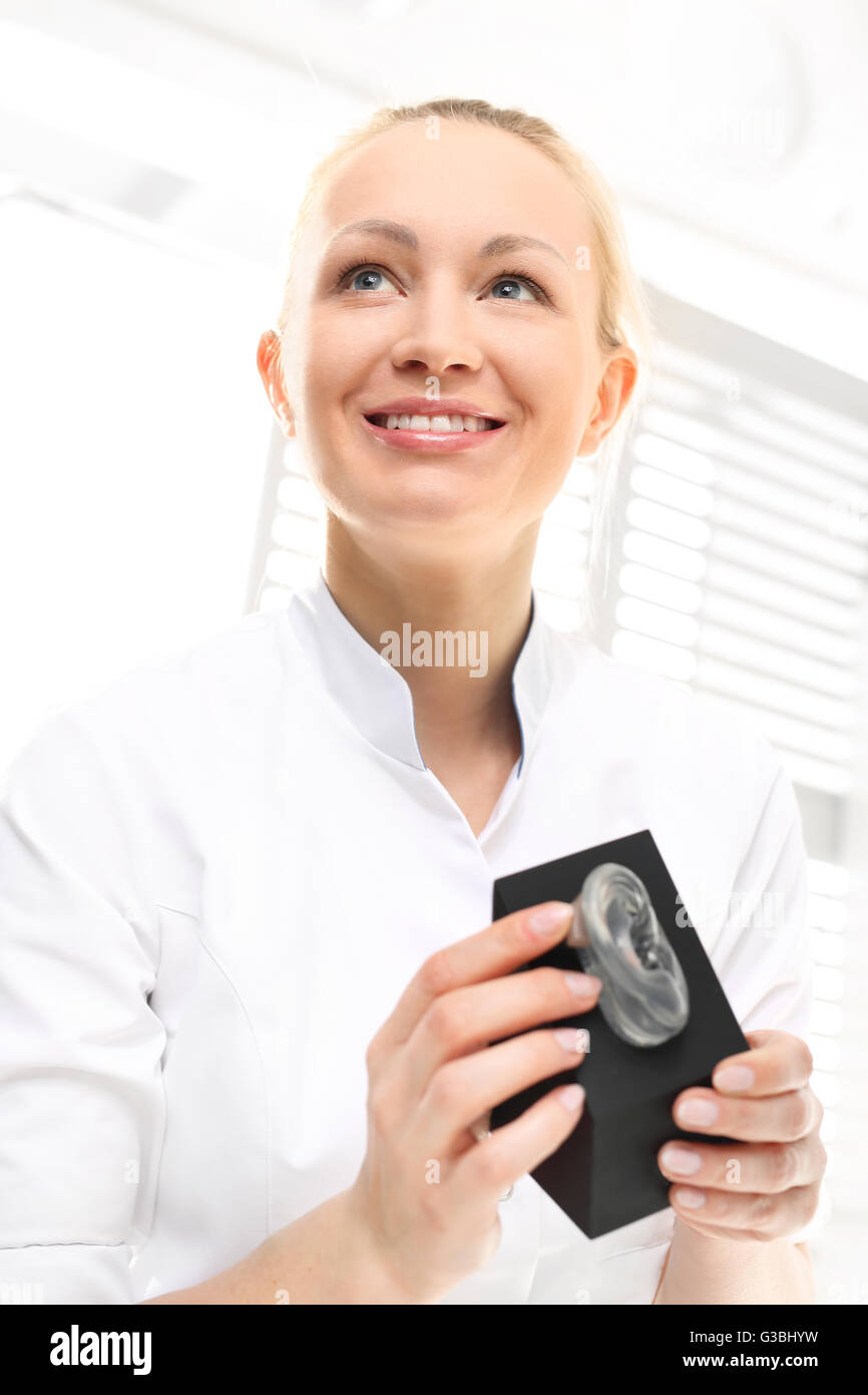 Female surgeon with silicone cast of the ear Stock Photo - Alamy