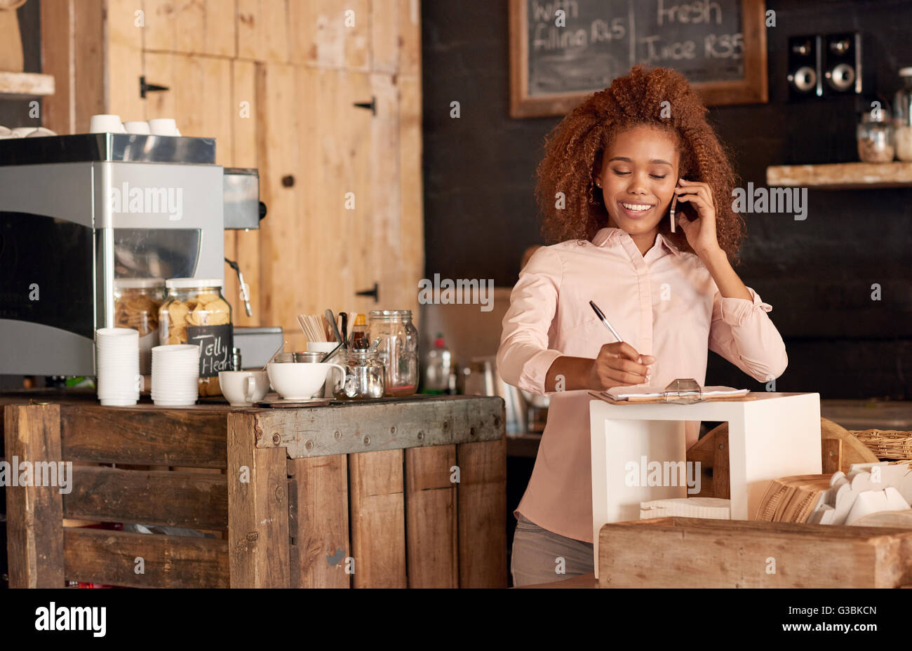 Taking orders and running a successful cafe Stock Photo - Alamy