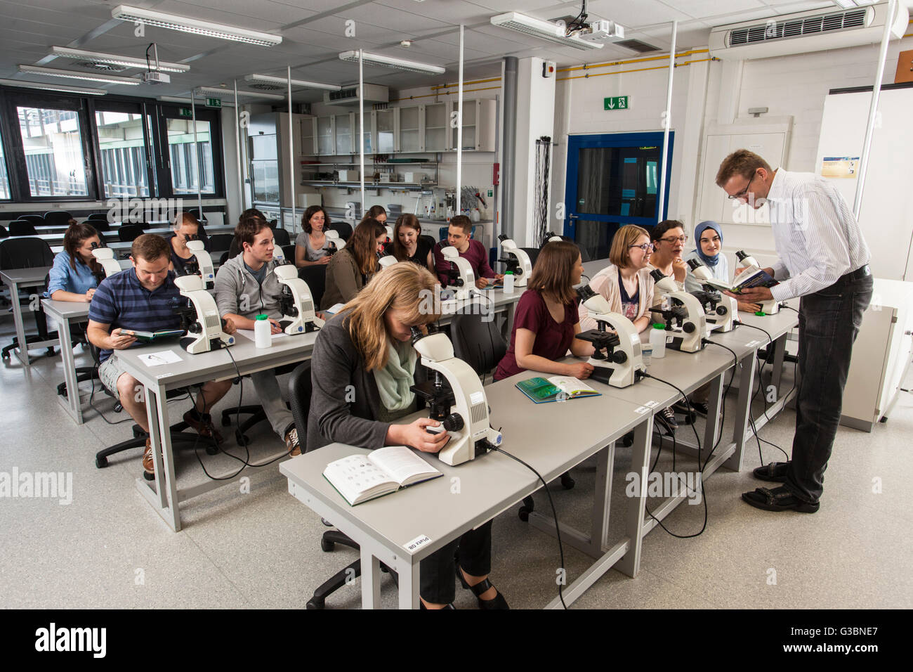 Students in a microscopy course at the university DUE Stock Photo - Alamy
