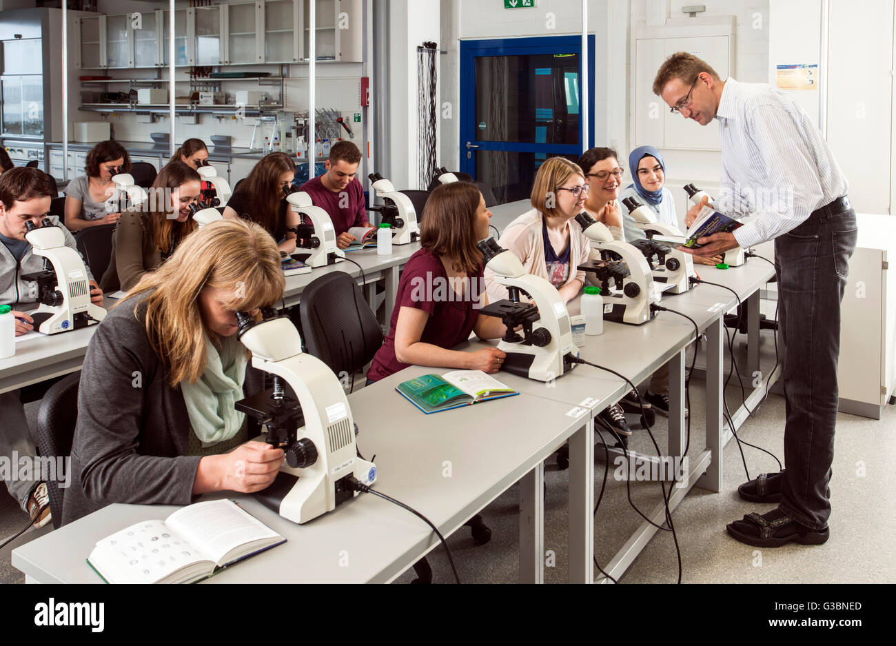 Students in a microscopy course at the university DUE Stock Photo - Alamy