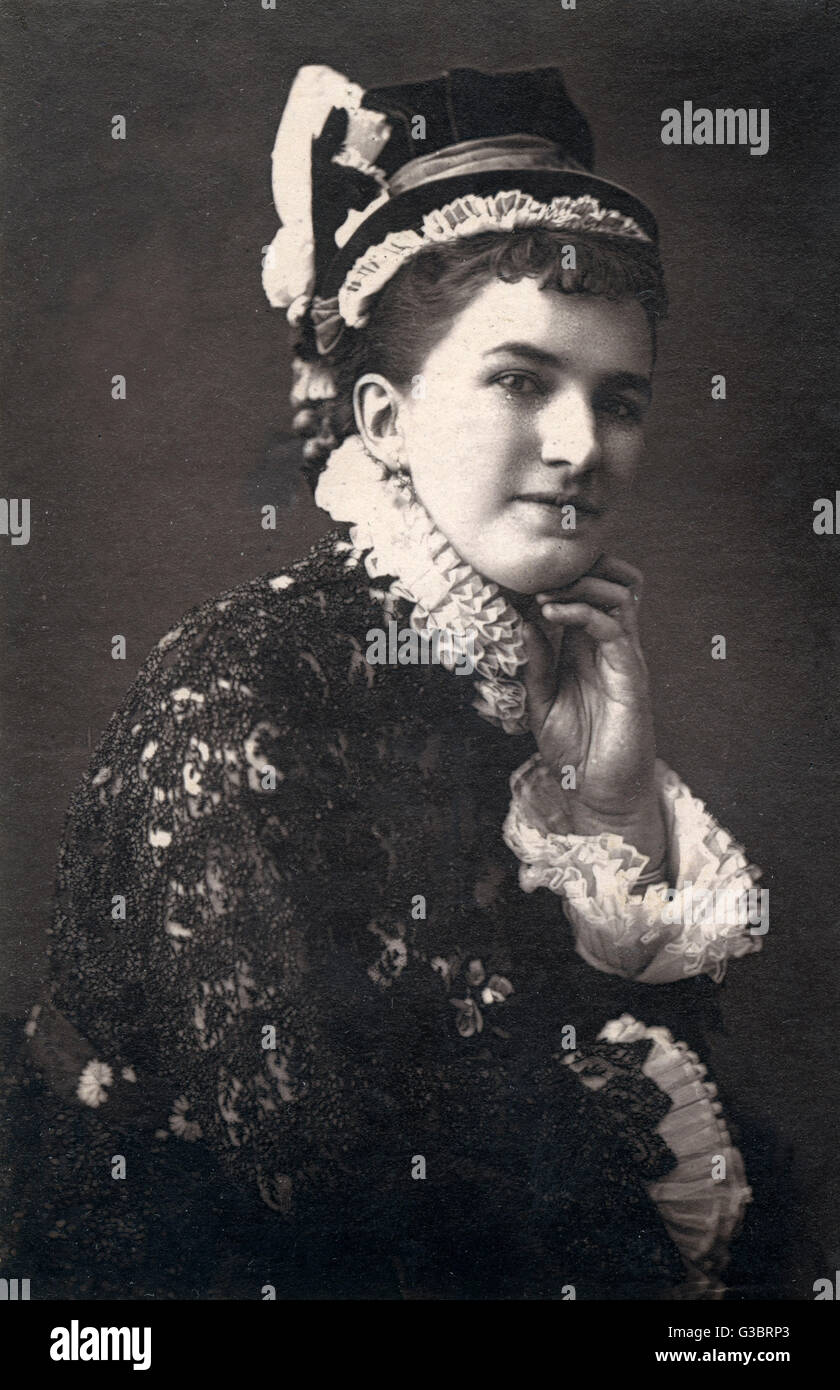 Victorian woman in frilly costume and hat Stock Photo - Alamy