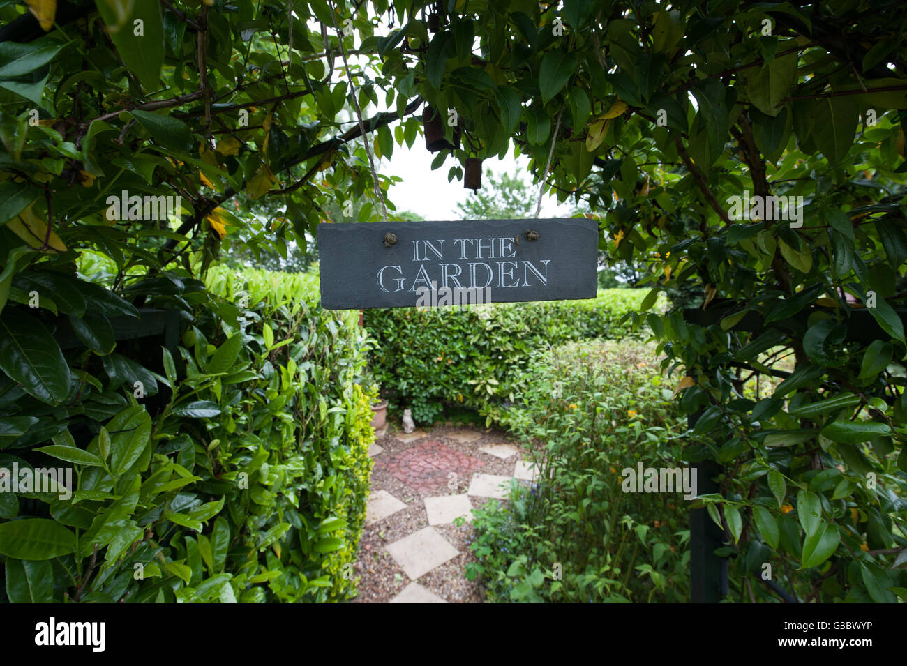 In the garden sign Stock Photo - Alamy