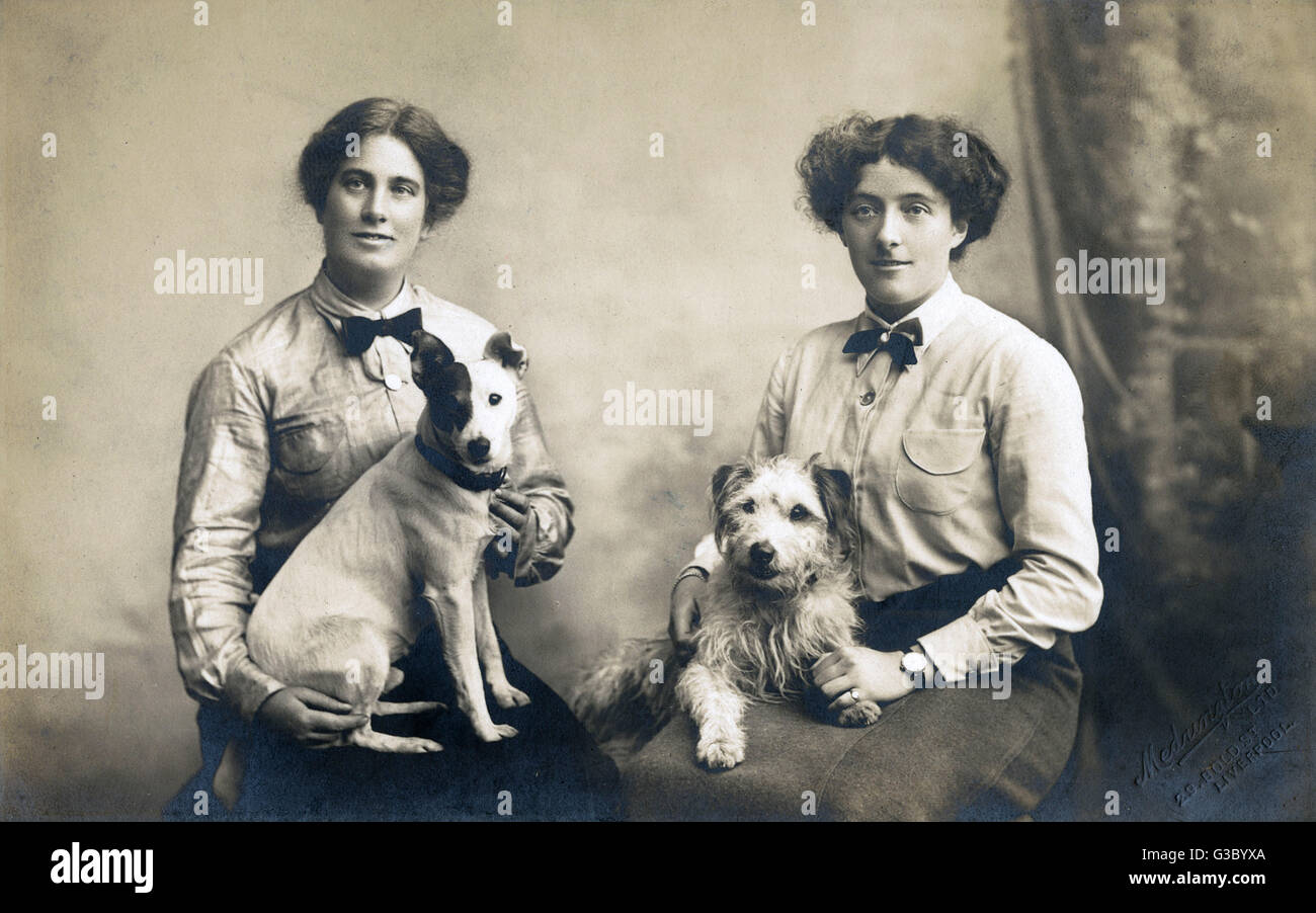 Two women with two little dogs Stock Photo - Alamy
