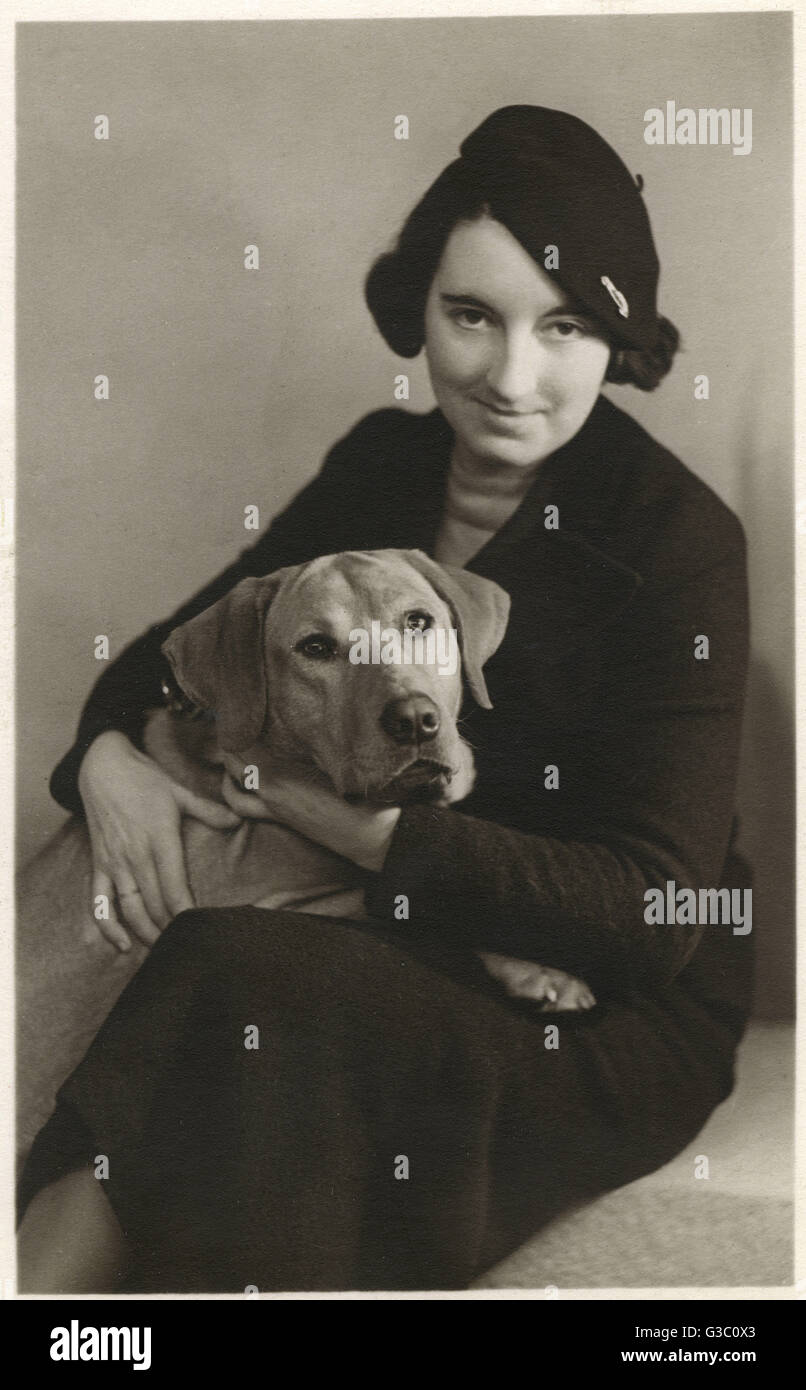 Studio portrait, woman with dog Stock Photo - Alamy