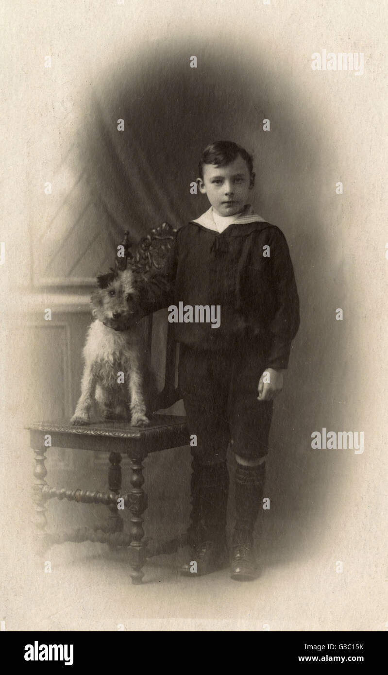 Studio portrait, boy with terrier dog Stock Photo - Alamy