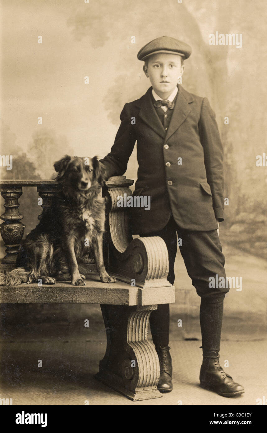 Studio portrait, boy with a dog Stock Photo - Alamy