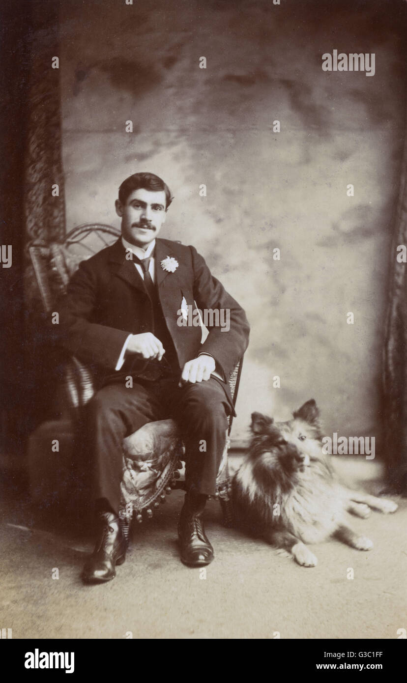 Studio portrait, young man with his dog Stock Photo - Alamy