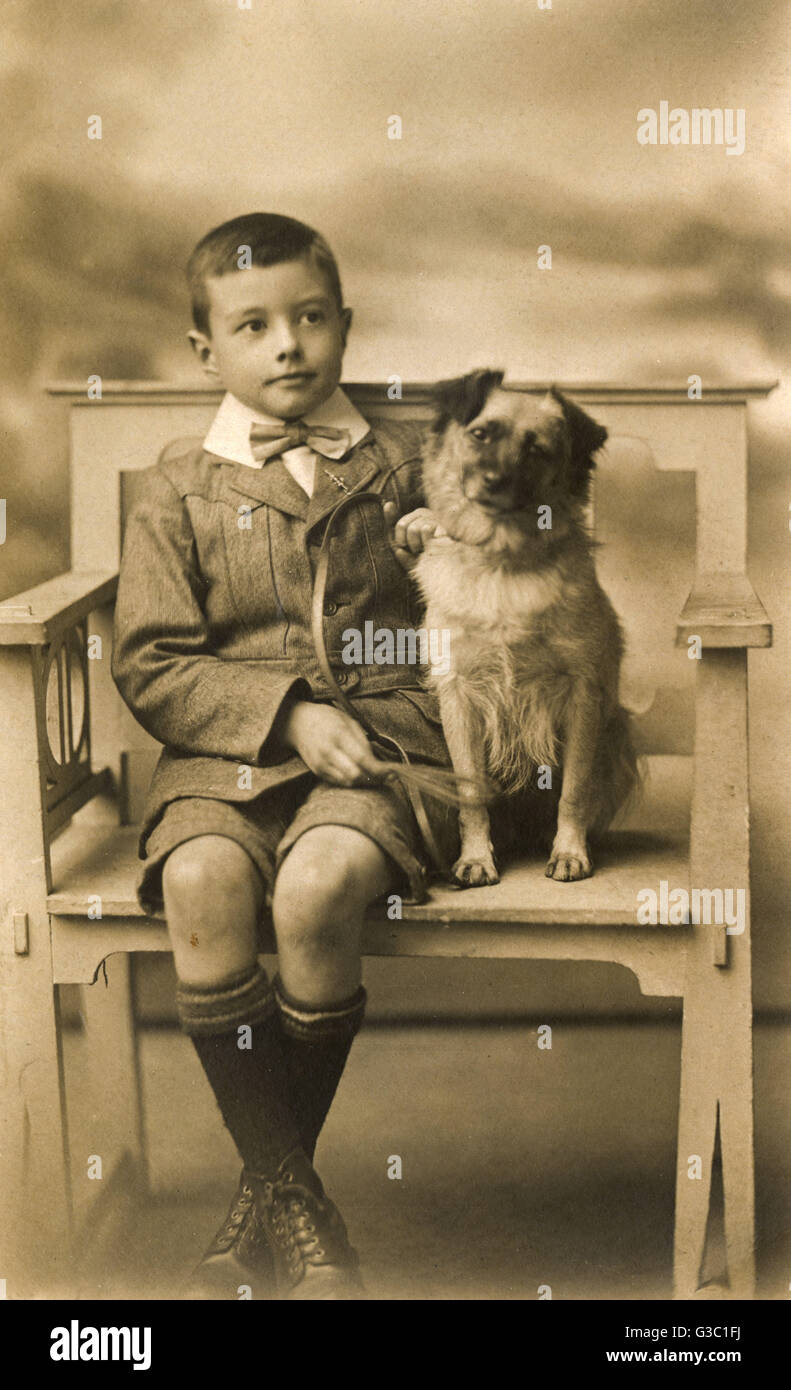 Studio portrait, little boy with his dog Stock Photo - Alamy